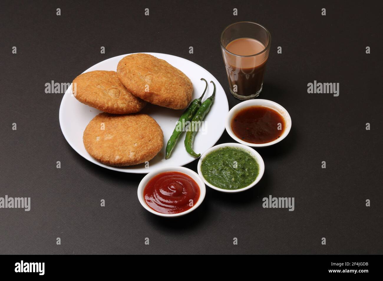Indian snakes food kachouri or kachoudi kachori served with masala or ...