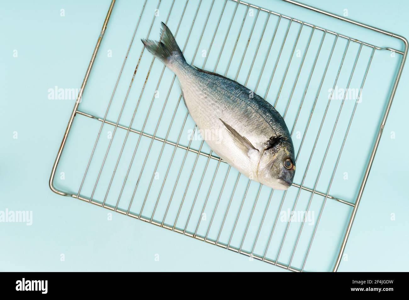 Whole fish cooked white background hi-res stock photography and images ...