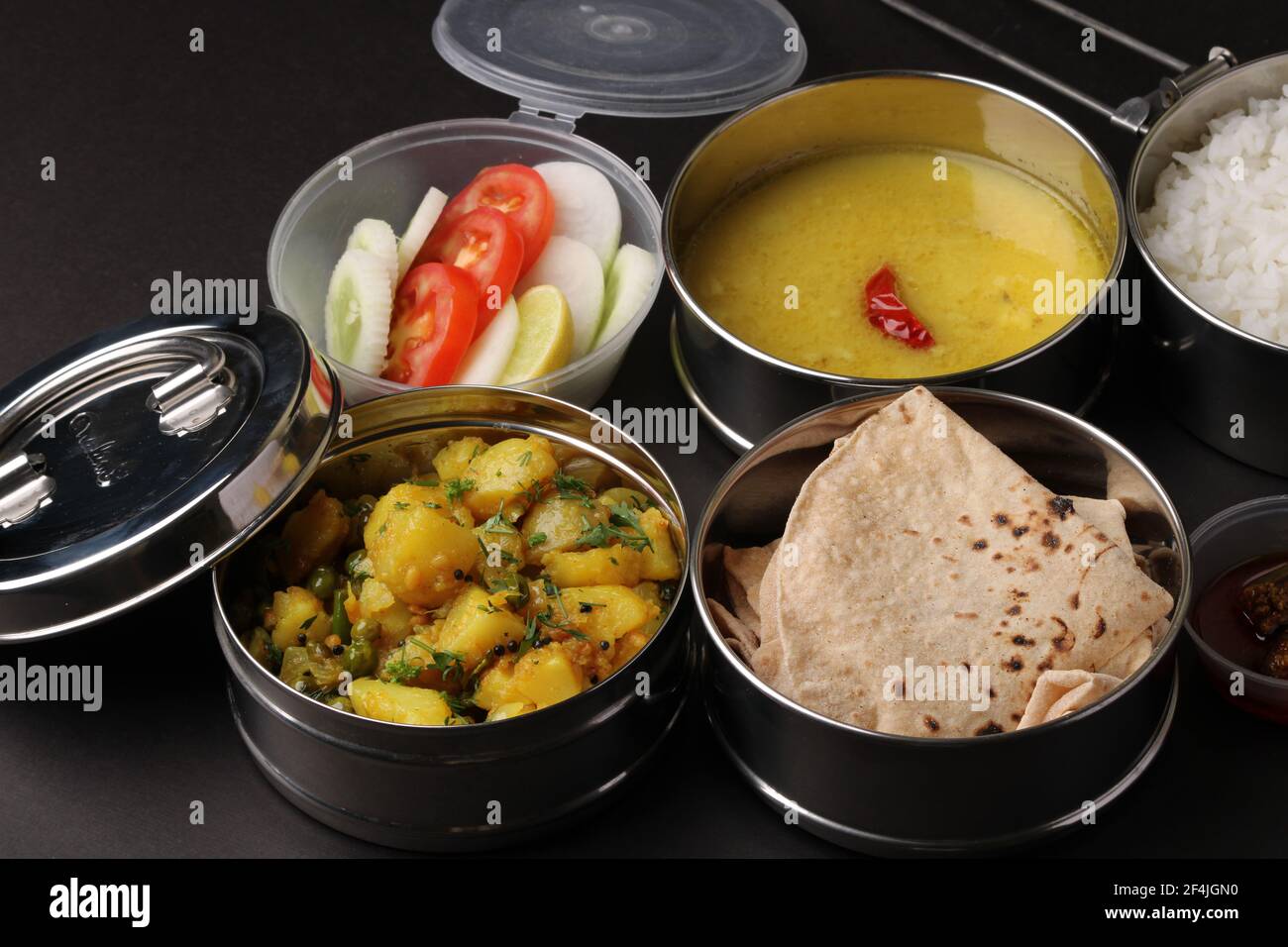 Typical Stainless steel Lunch Box or Tiffin with Maharashtrian food ...