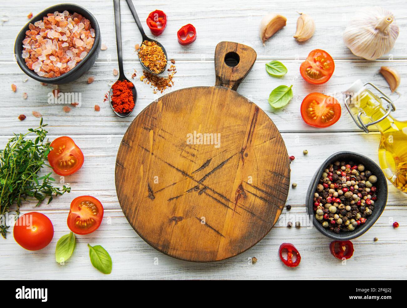 Cooking wooden utensils, empty cutting board and spices. Food cooking ...