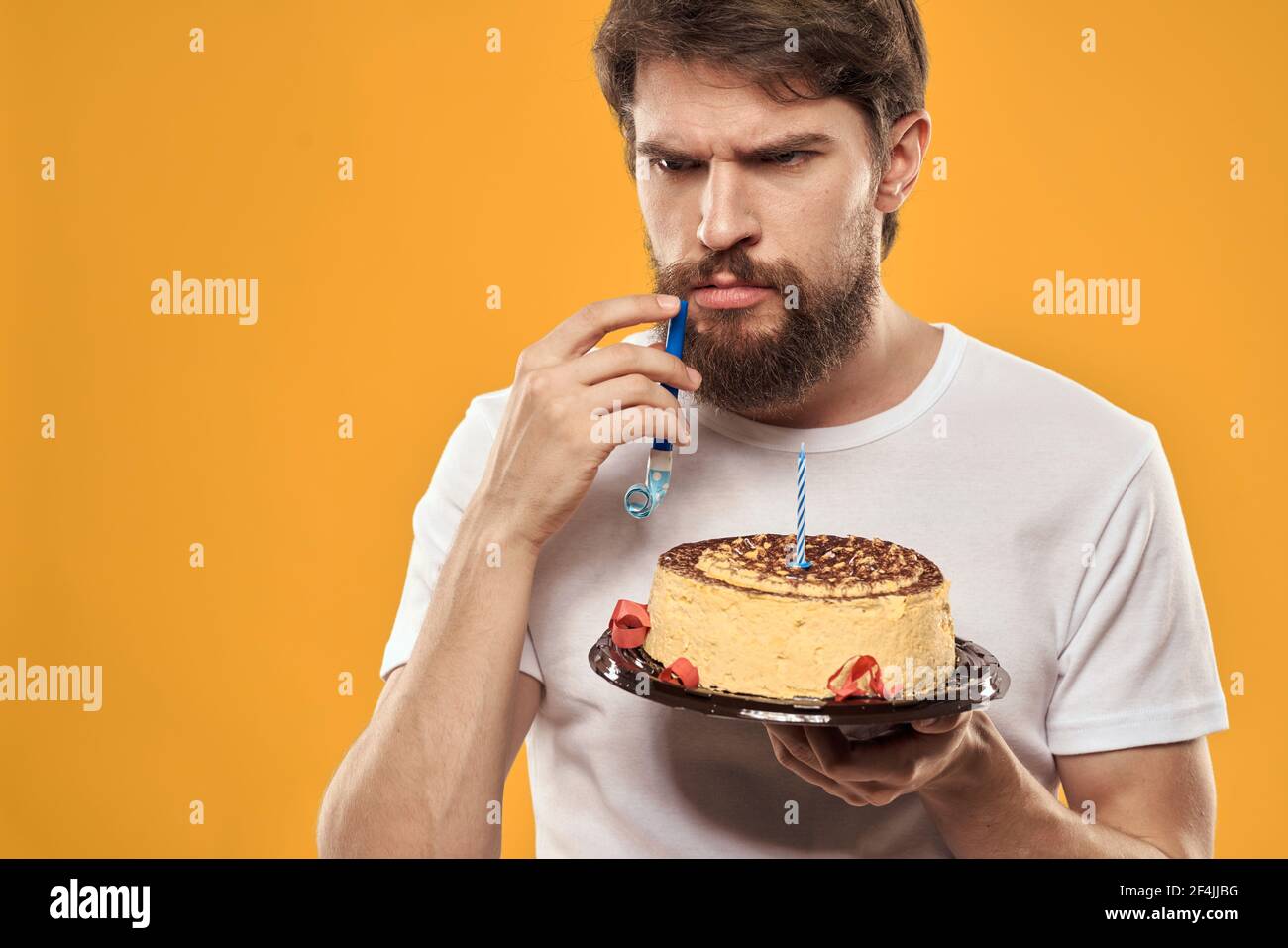 Cheerful bearded man holiday yellow background fun Stock Photo - Alamy