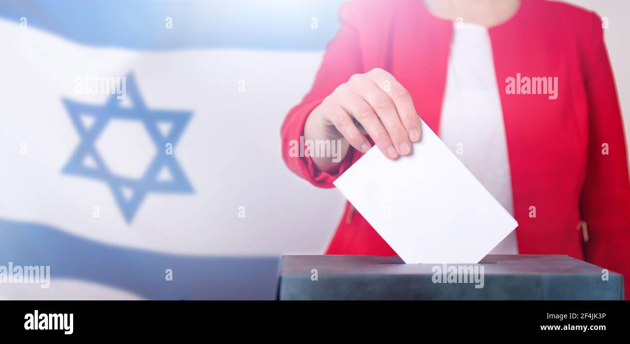 Election in Israel. Hand of voter putting vote in the ballot box. Waved ...