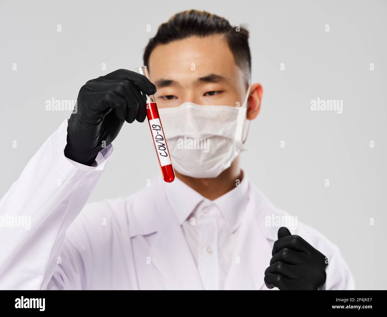 Male laboratory assistant holds in his hands tests diagnostics ...