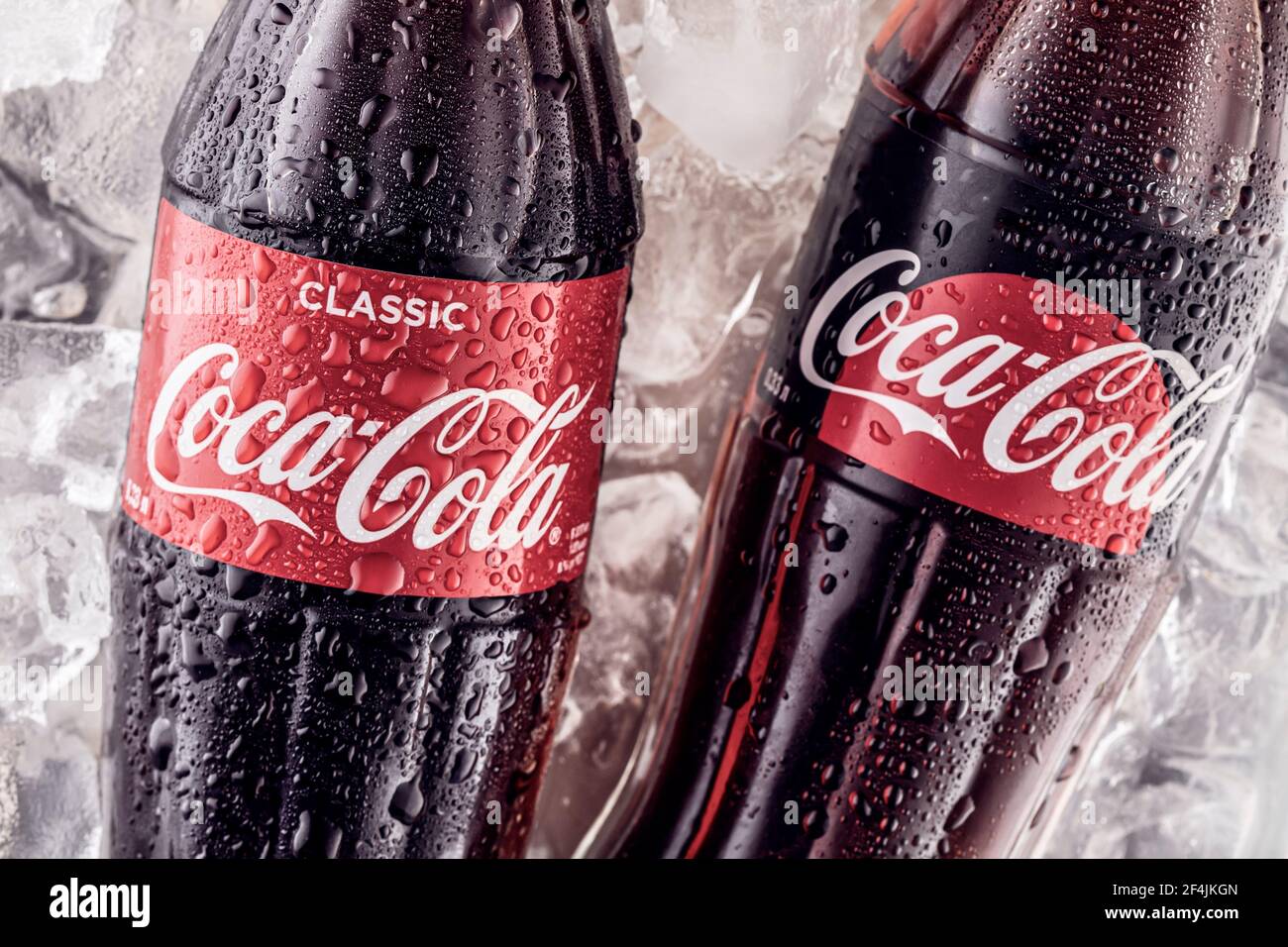 Coca-Cola logo on classic cola bottles and sugar-free on an ice cube ...