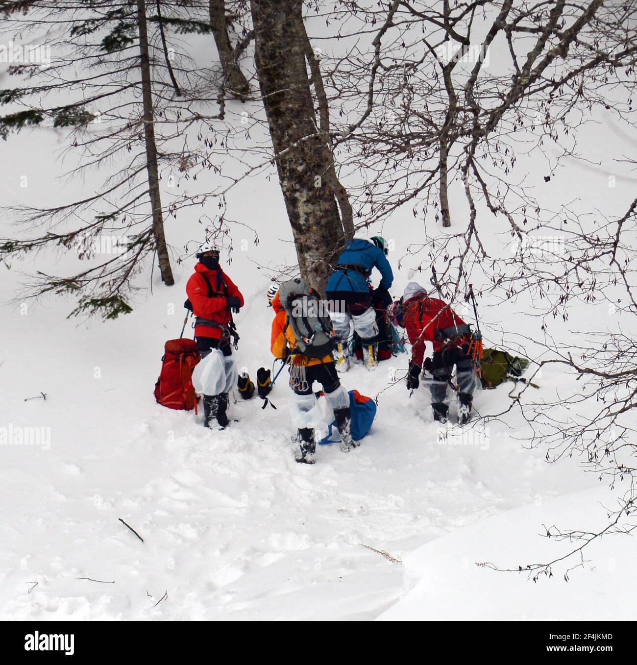 Adventurous Japanese hikers embarking on a hike in the icy mountains ...