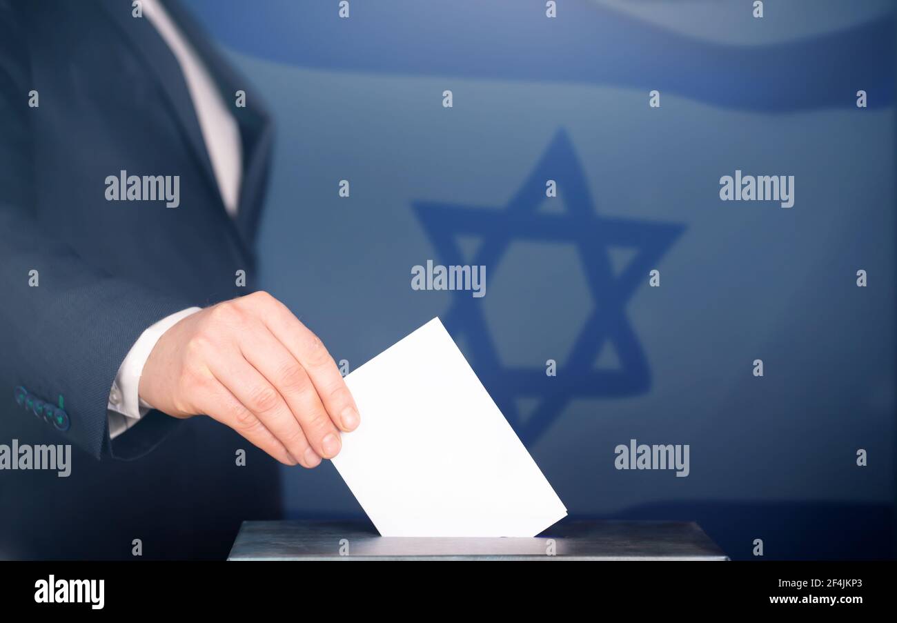 Election in Israel. Hand of voter putting vote in the ballot box. Waved ...