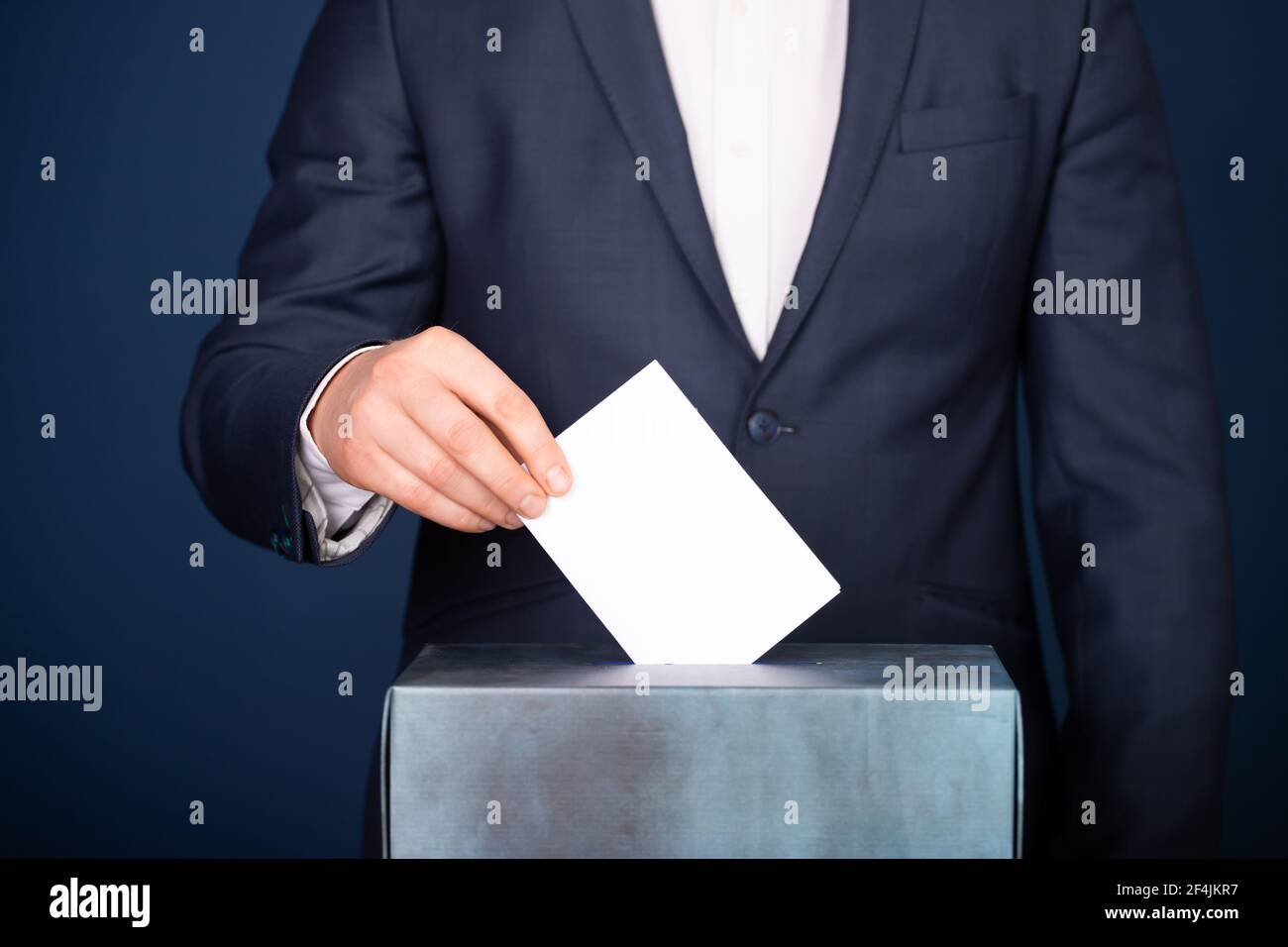 Voter putting vote in the ballot box. Election concept Stock Photo - Alamy