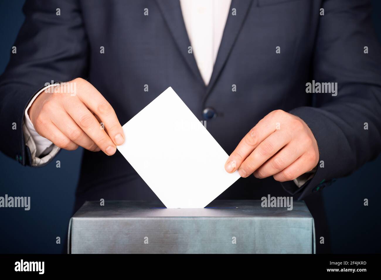 Voter putting vote in the ballot box. Election concept Stock Photo - Alamy