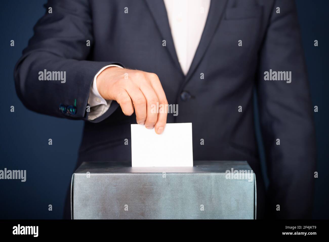 Voter putting vote in the ballot box. Election concept Stock Photo - Alamy