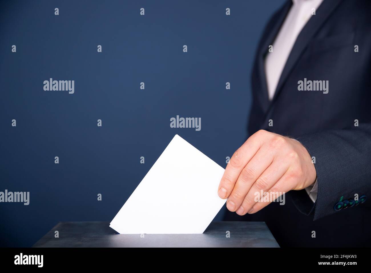 Voter putting vote in the ballot box. Election concept Stock Photo - Alamy