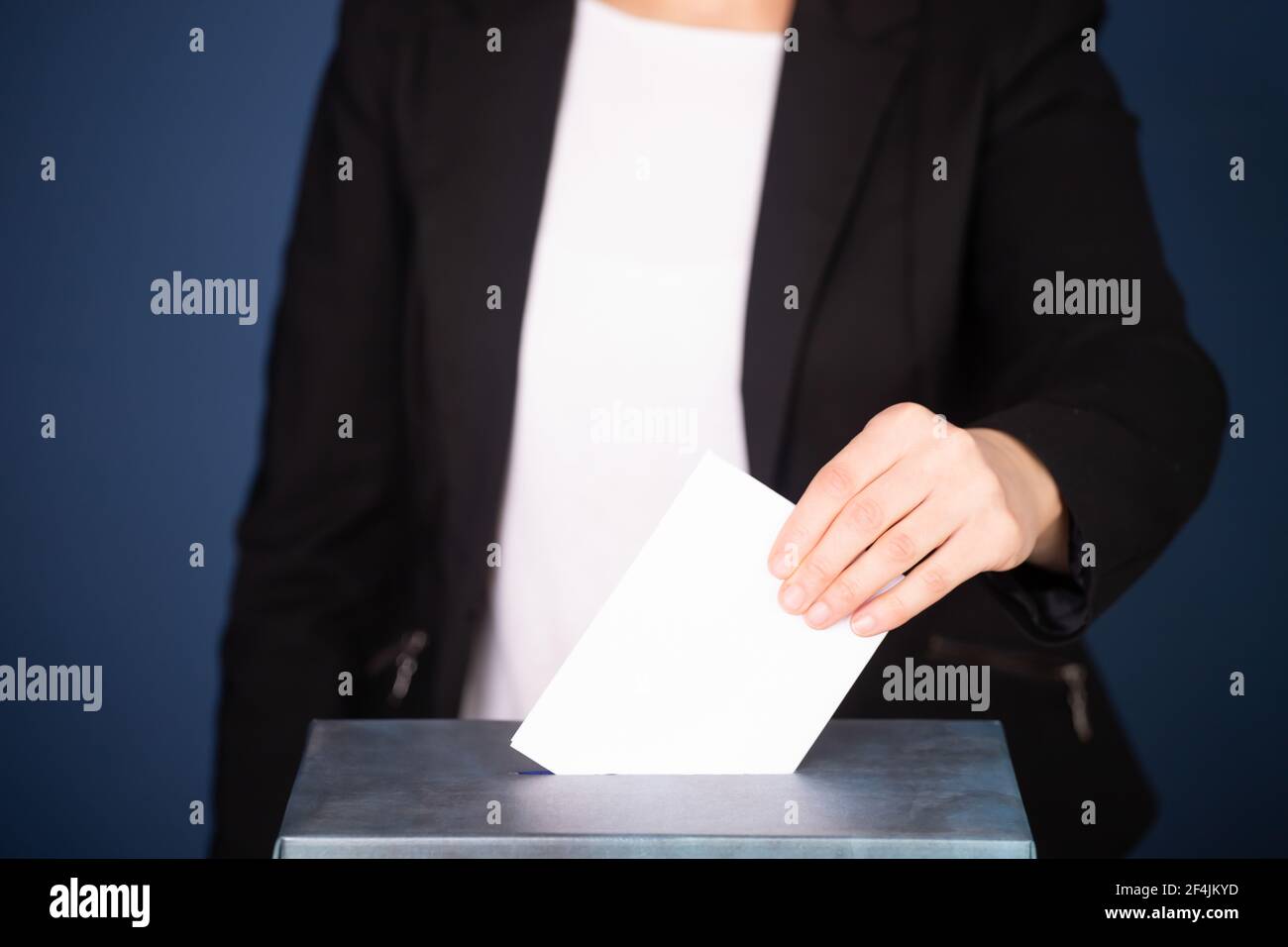 Voter putting vote in the ballot box. Election concept Stock Photo - Alamy