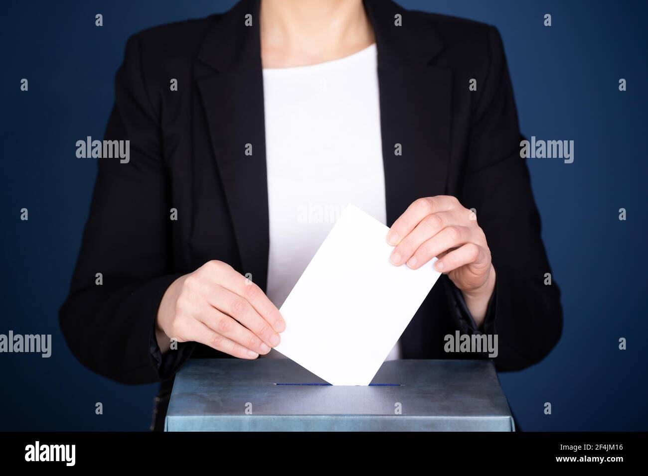 Voter putting vote in the ballot box. Election concept Stock Photo - Alamy