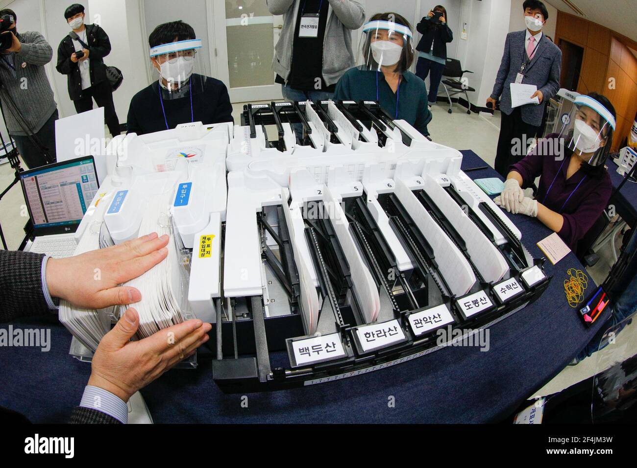 22nd Mar, 2021. Voting demonstration Election officials showcase ballot ...