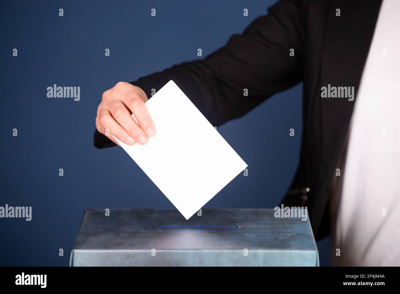 Voter putting vote in the ballot box. Election concept Stock Photo - Alamy