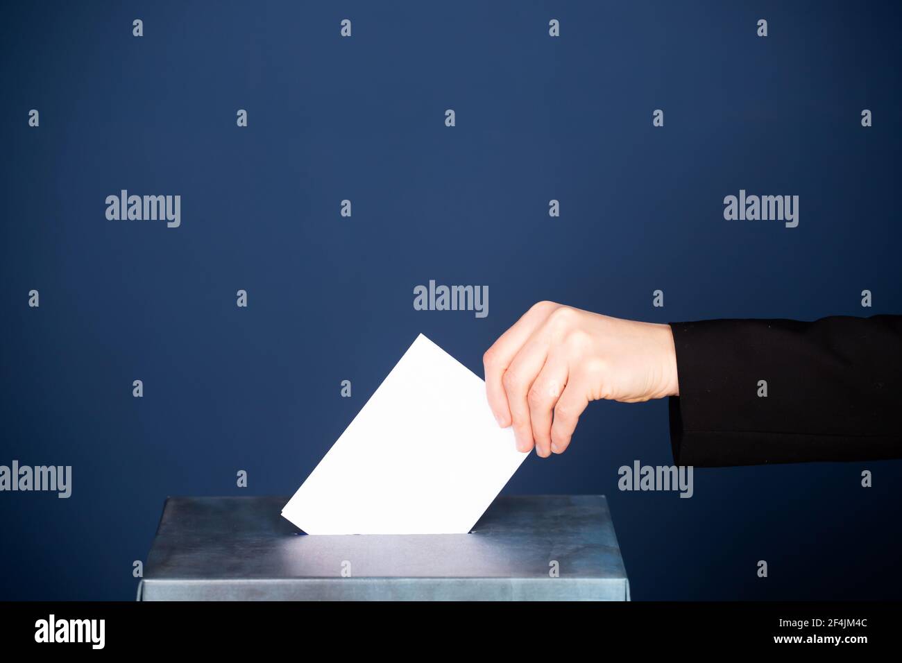 Voter putting vote in the ballot box. Election concept Stock Photo - Alamy