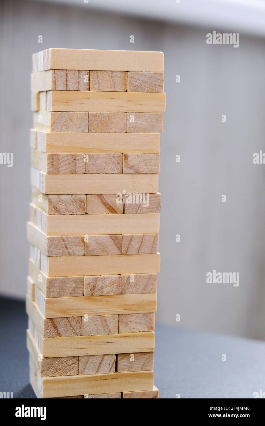 Building from wooden blocks. Wood blocks stack game with Hand on ...