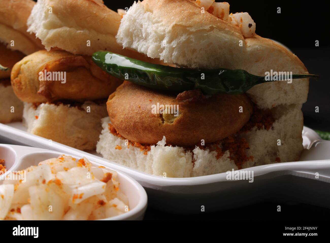 Bombay vada paav is an indian burger. Potato patty is deep fried in ...