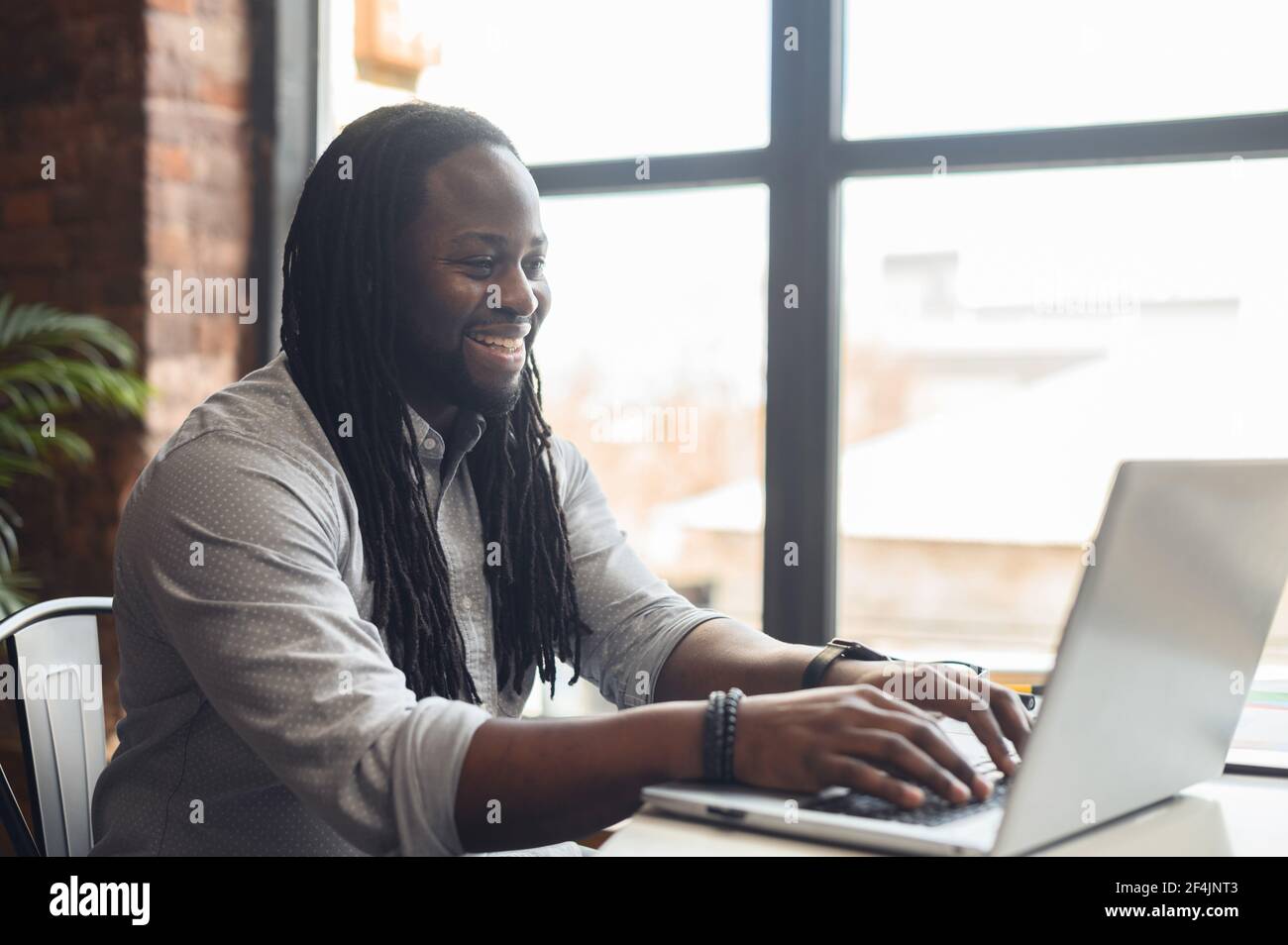 African american blogger typing hi-res stock photography and images - Alamy
