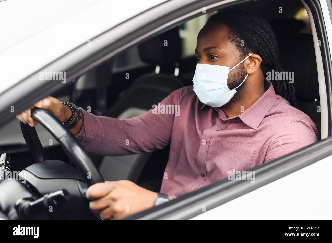 African American male taxi car driver wearing protective face mask or ...