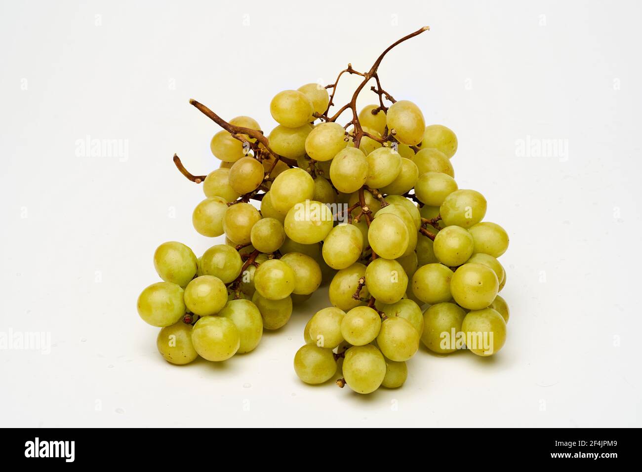 Bunch of yellow sweet seedless grapes isolated on white background ...