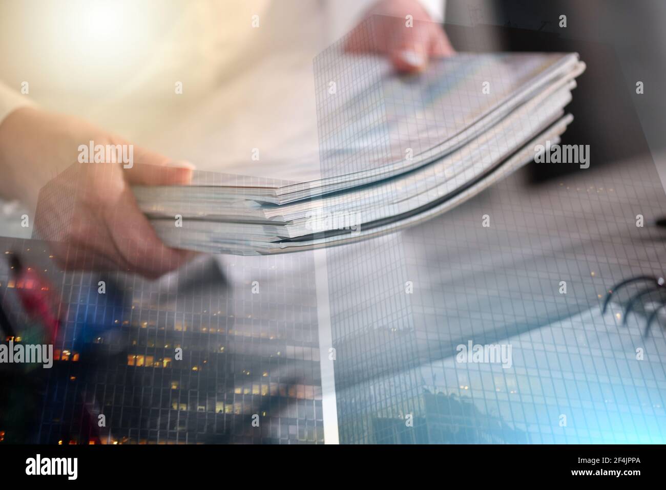 Female hands holding a stack of magazines; multiple exposure Stock ...