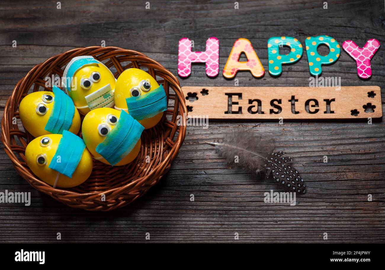 Happy Easter card with colorful hand Easter eggs wearing tiny surgical ...