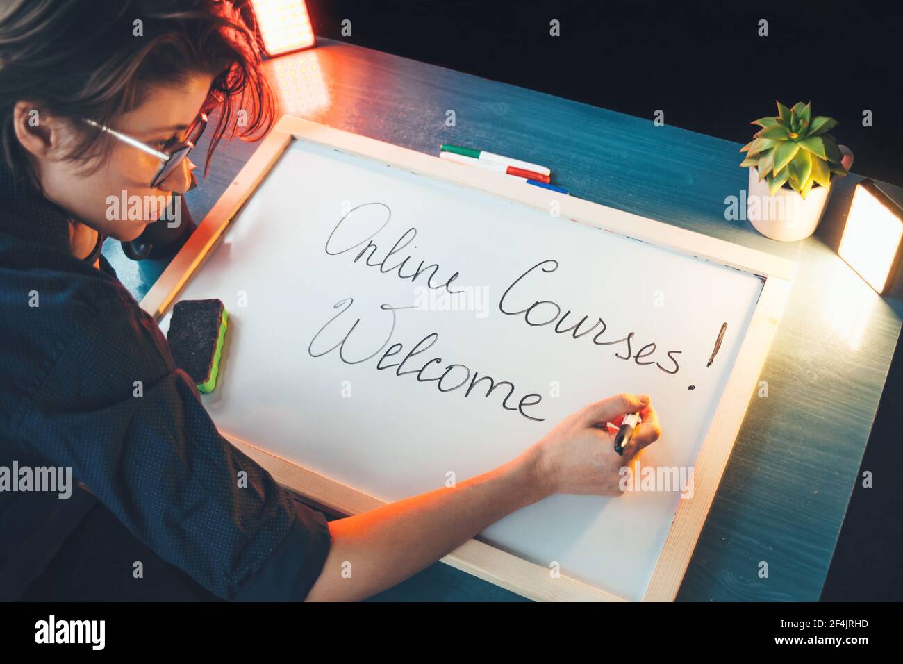 Woman writing on back board hi-res stock photography and images - Alamy