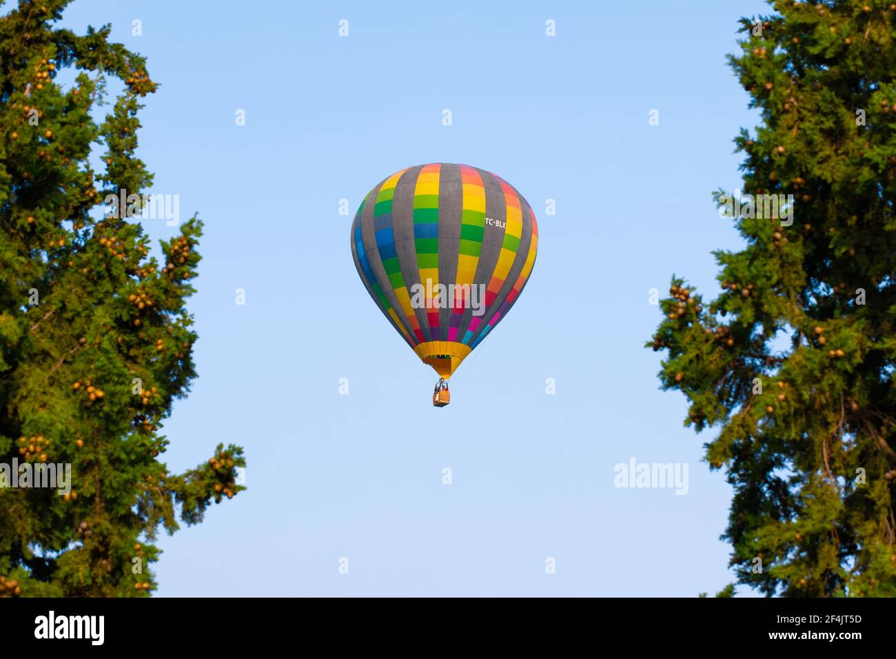 Bright colored beautiful hot air balloon fly on sky background of ...
