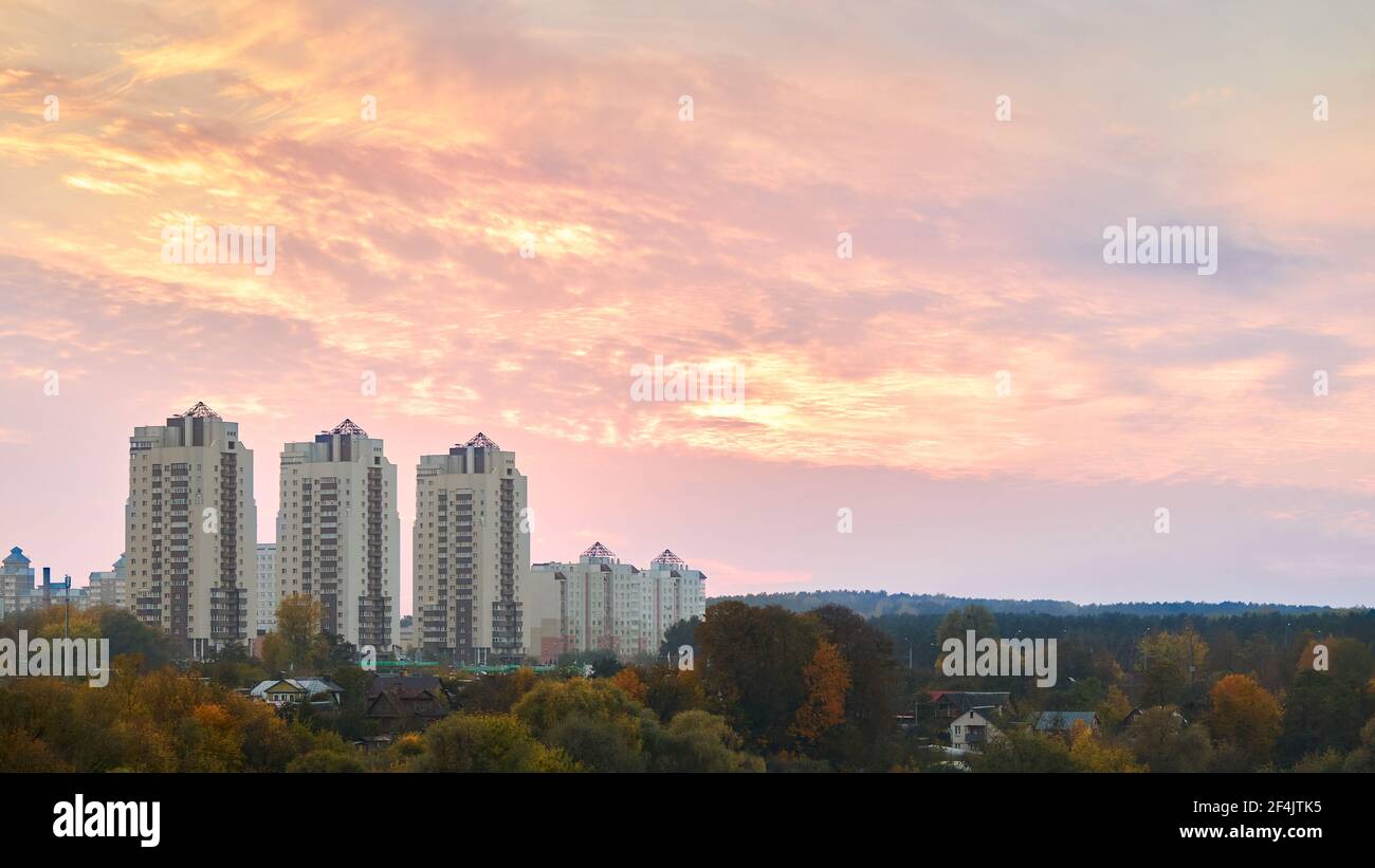 Apartment buildings at sunset. Colorful evening dusky sky high-rise ...