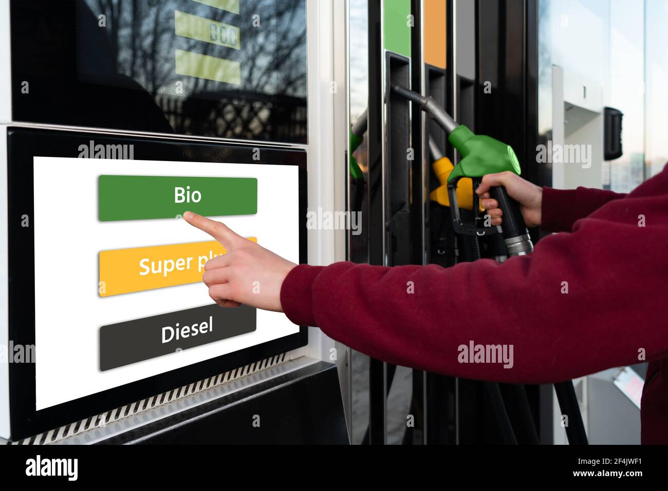 A man chooses biofuel at a self-service gas station Stock Photo - Alamy