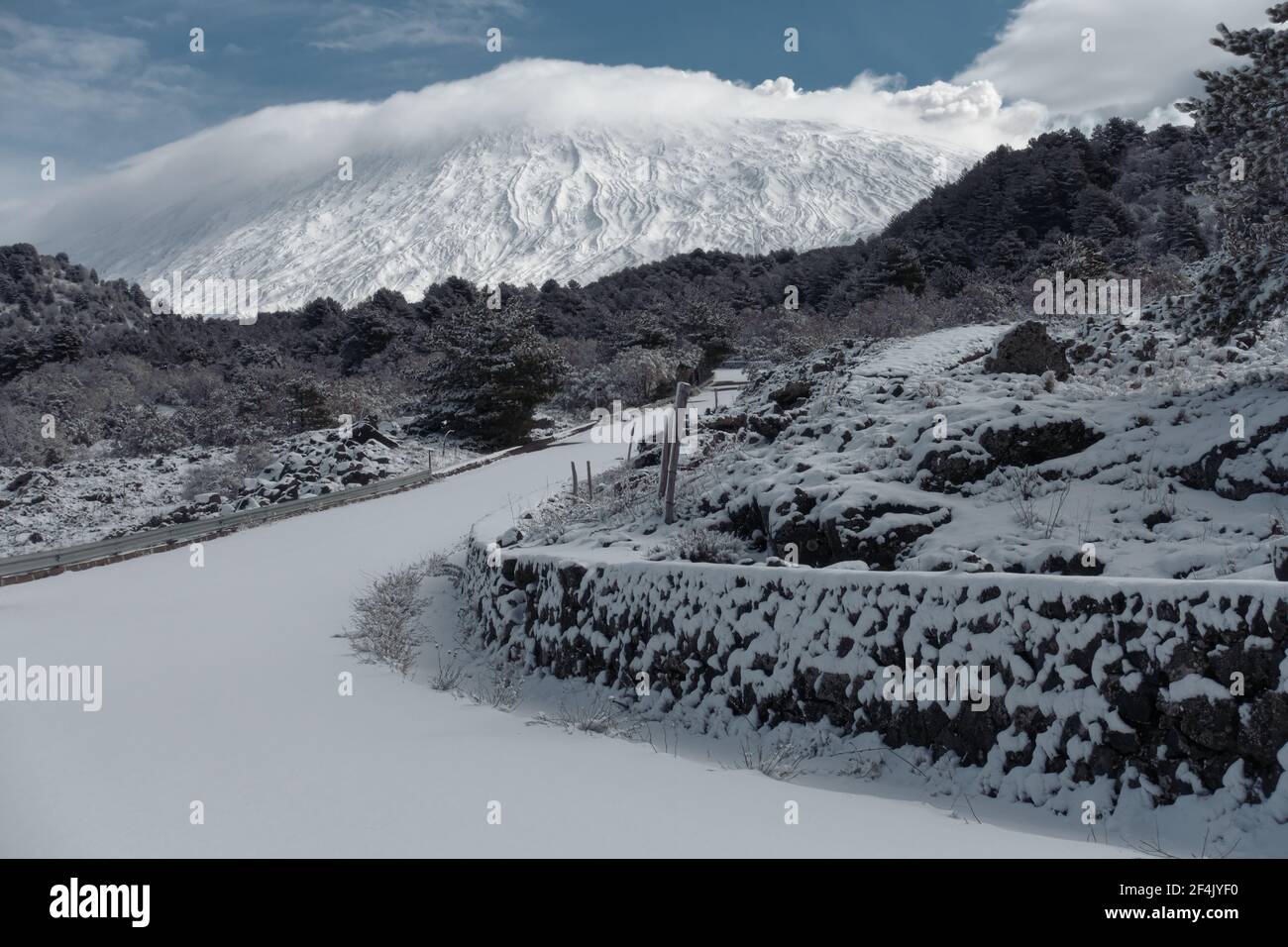 winter landscape of Sicily nature snow covered road mountain to Etna ...