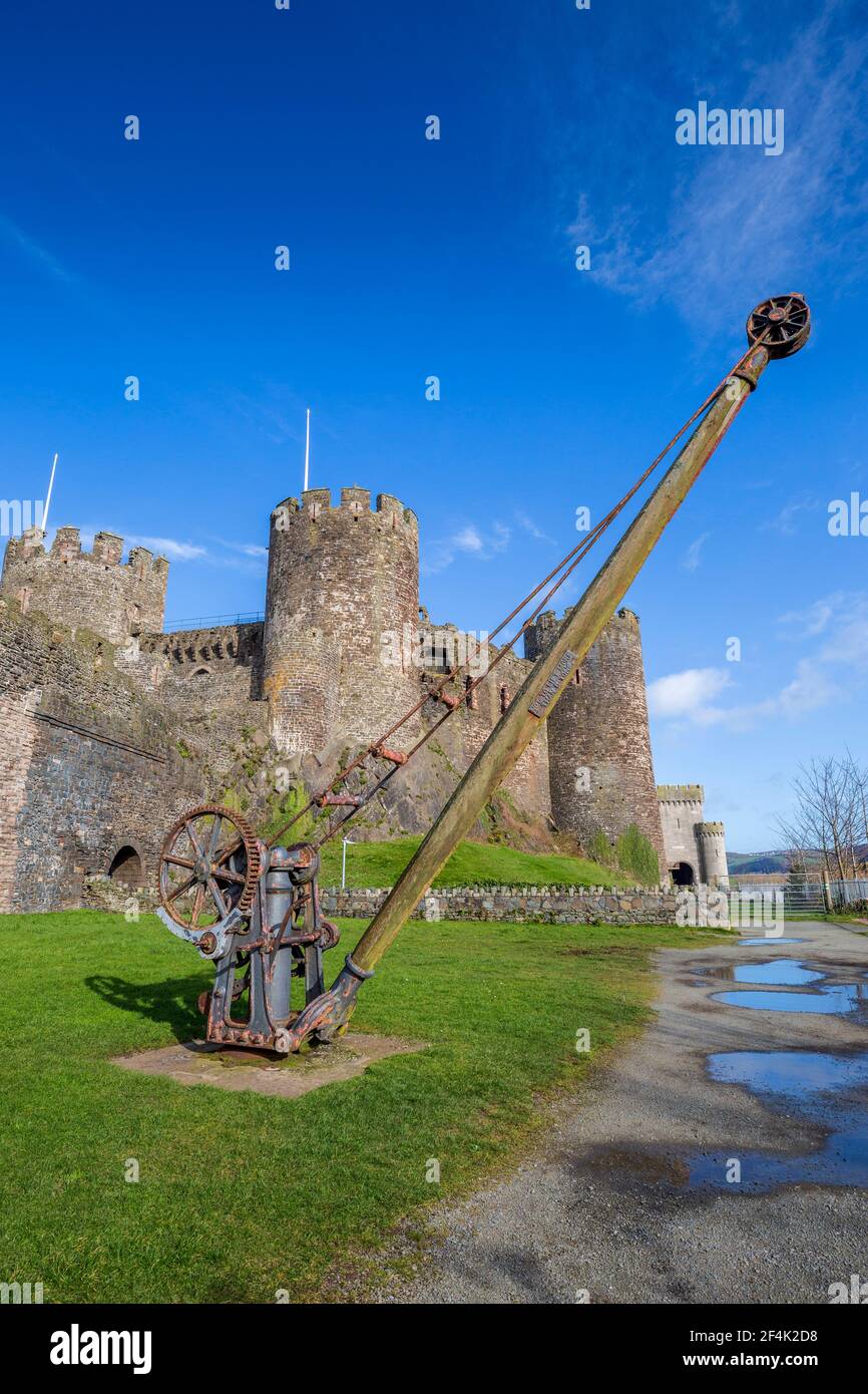 Conwy Castle with a disused railway crane besides the old rail siding ...