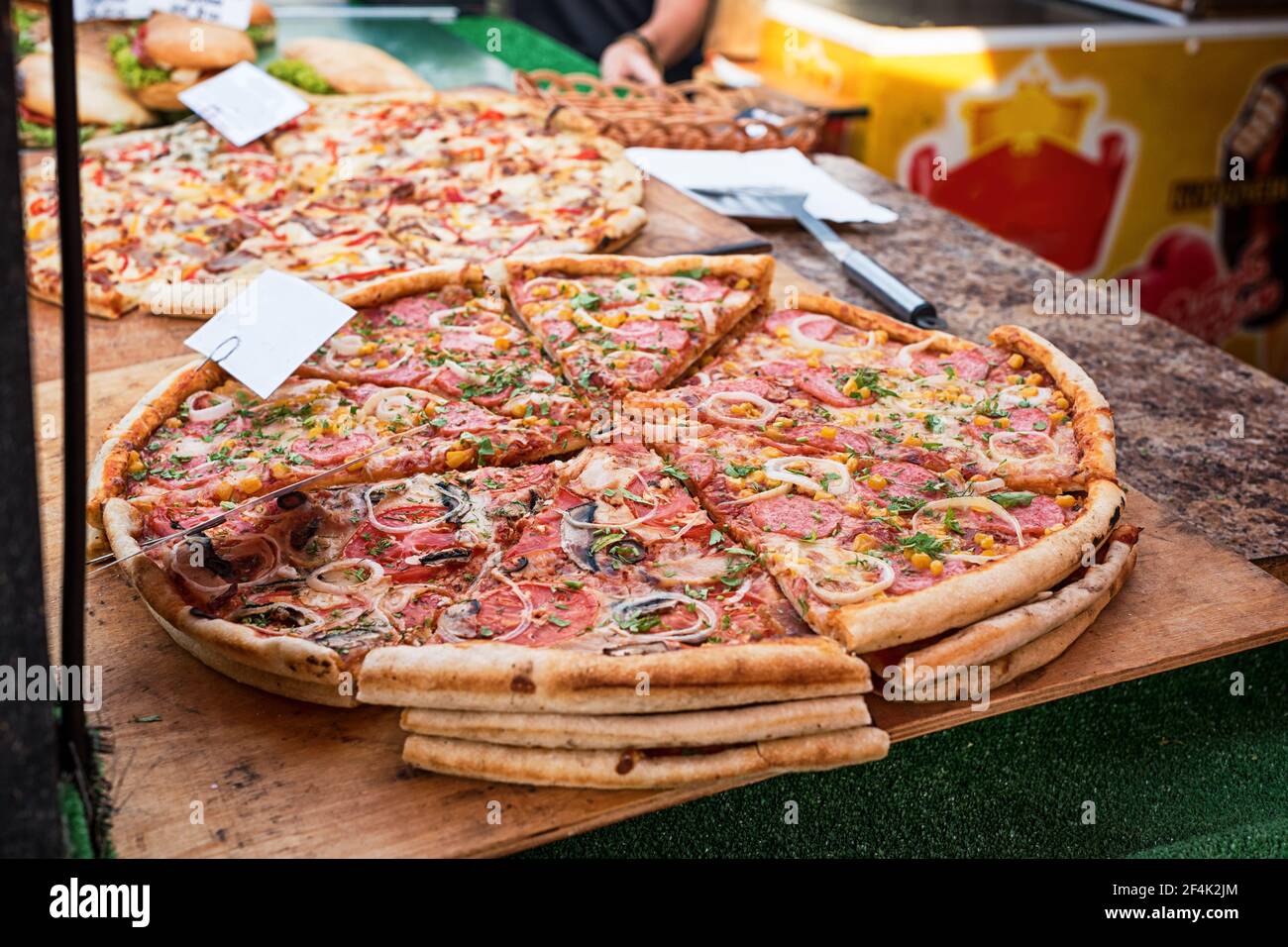 Closeup of pizza in street fast food cafe. Italian outdoor cafe Stock ...