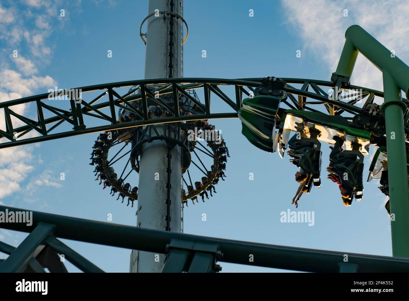 People screaming and holding up hands during Roller Coaster ride Helix ...