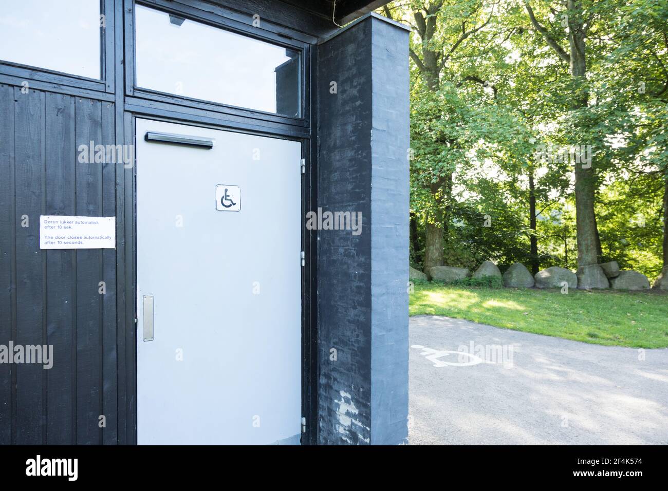 Exterior of door bathroom for disabled Stock Photo - Alamy