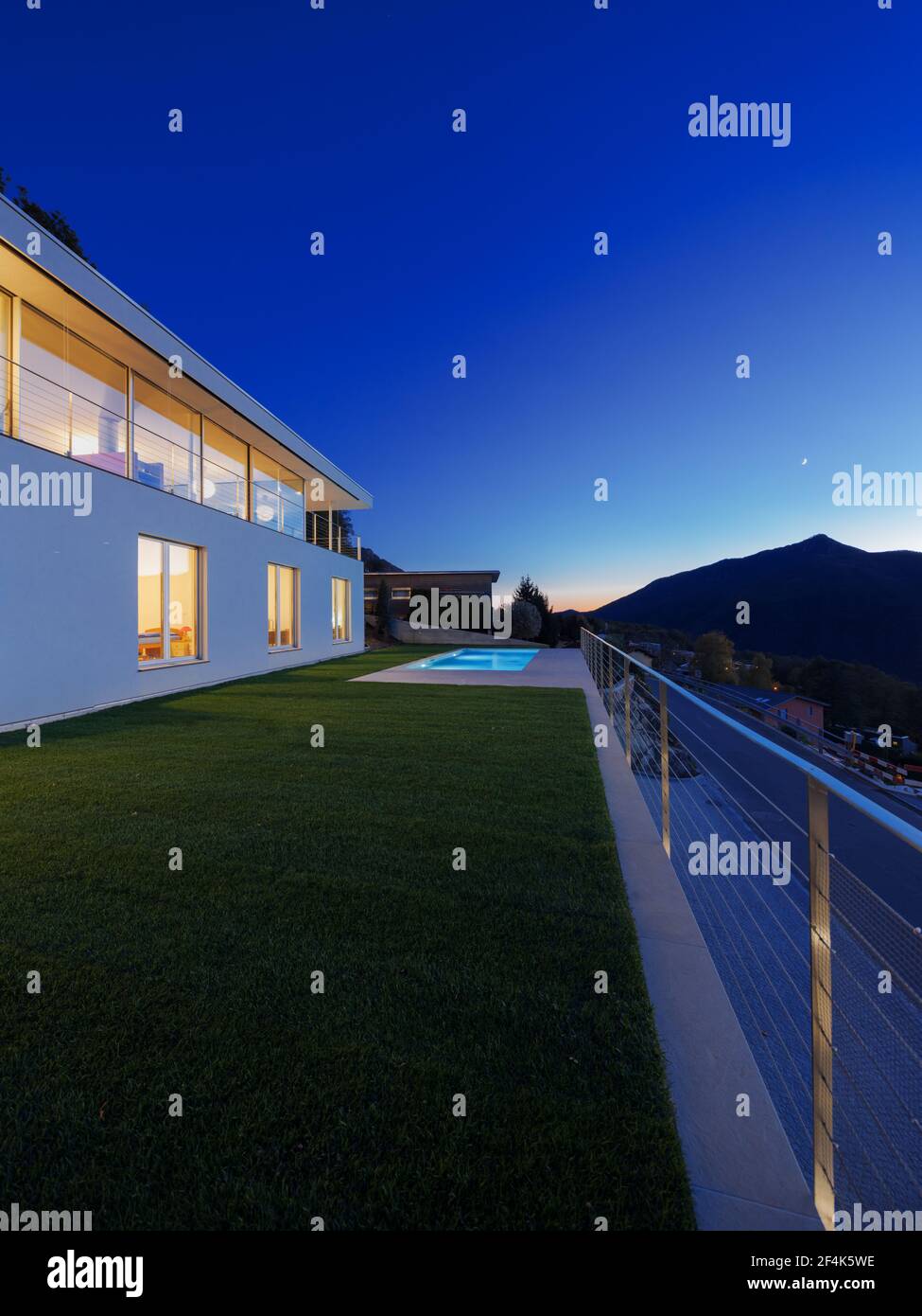 Modern house, exterior in the night, lights on Stock Photo - Alamy