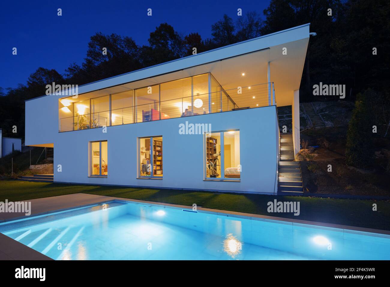 Modern house, exterior in the night, lights on Stock Photo - Alamy