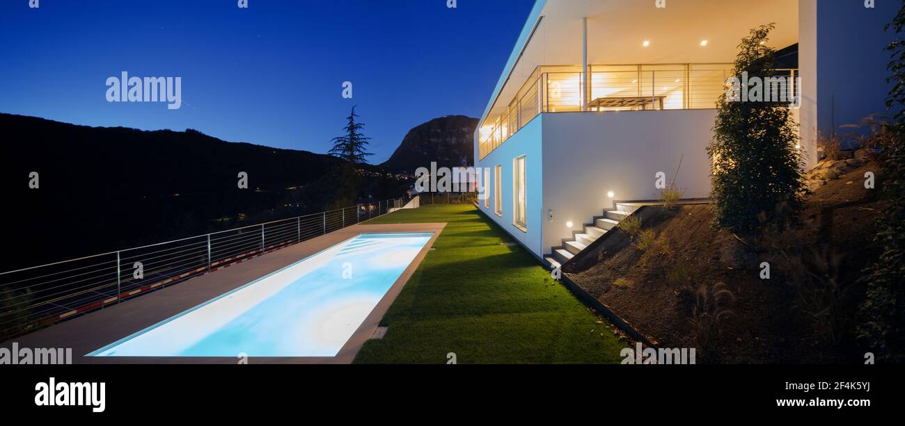 Modern house, exterior in the night, lights on Stock Photo - Alamy