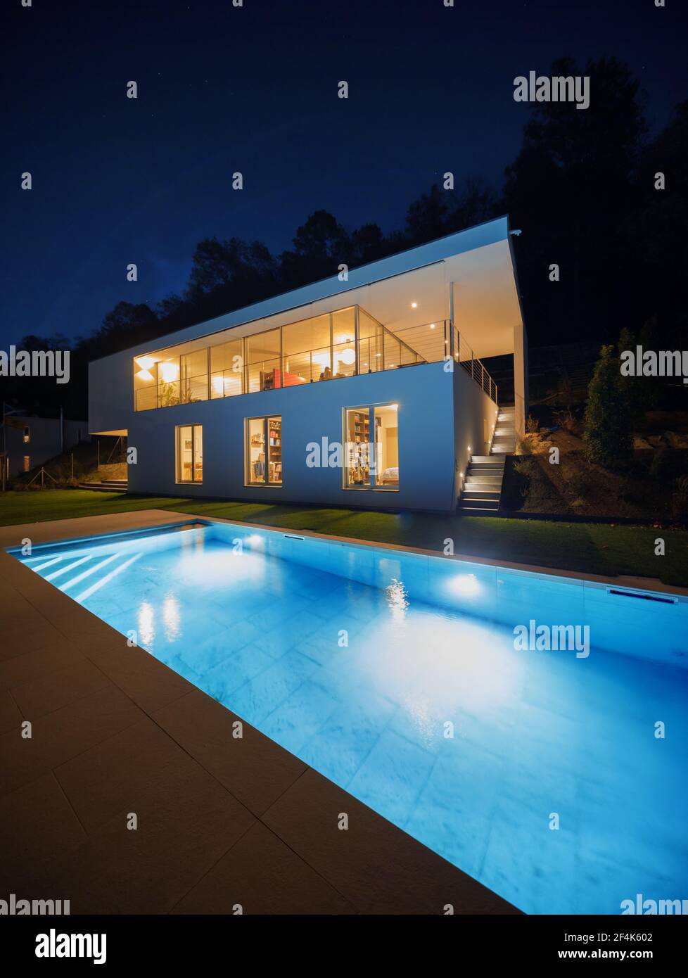 Modern house, exterior in the night, lights on Stock Photo - Alamy