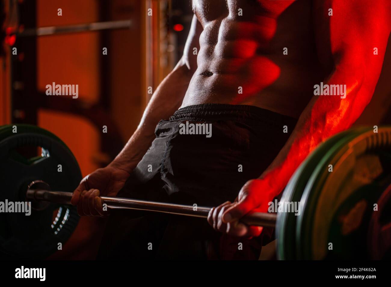 Close up training with barbell. Man lifting barbells working out in gym ...