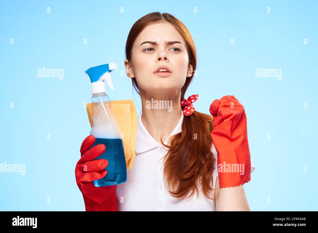 professional cleaning lady cleaning supplies work blue background Stock ...
