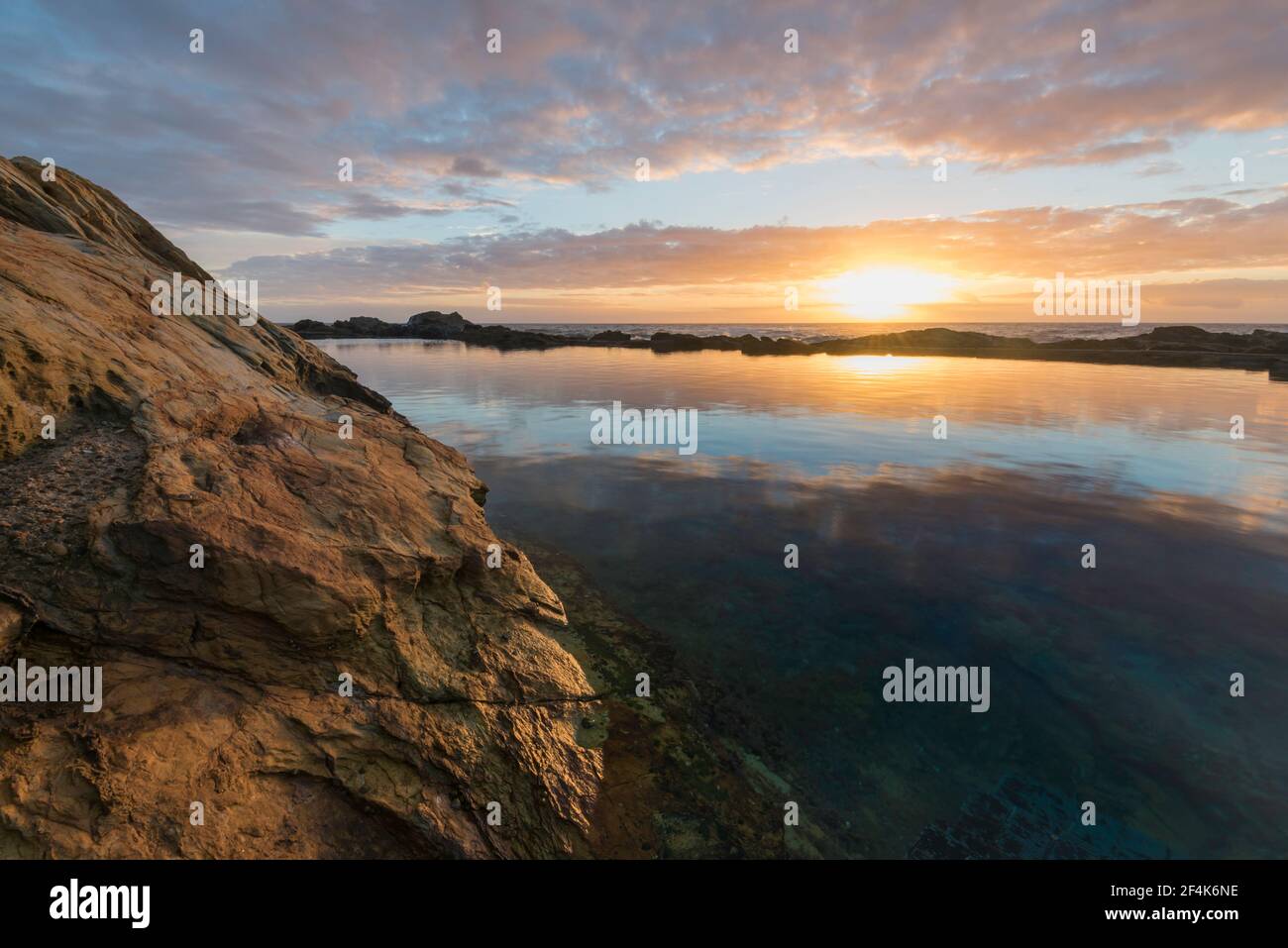 Dawn sunrise at the famous Blue Pool (heritage listed ocean pool) at ...