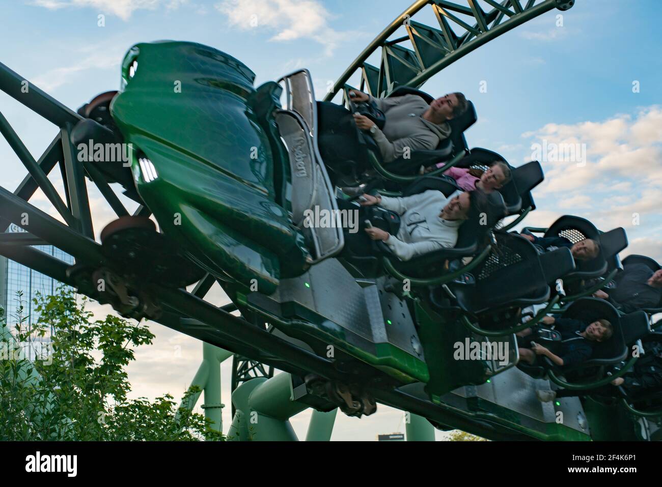 People screaming and holding up hands during Roller Coaster ride Helix ...