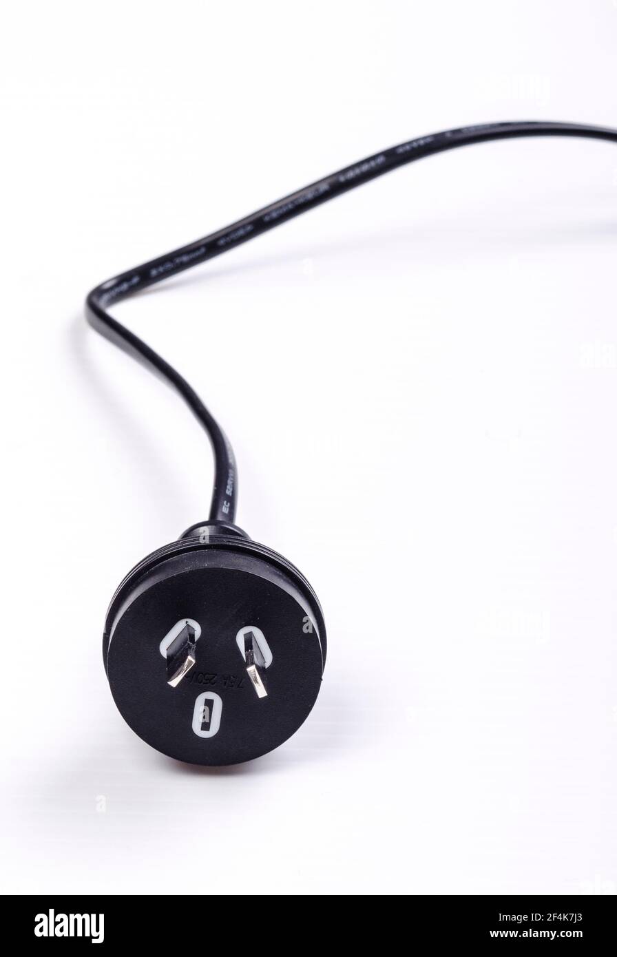 A black Australian power cord plug on white background Stock Photo - Alamy