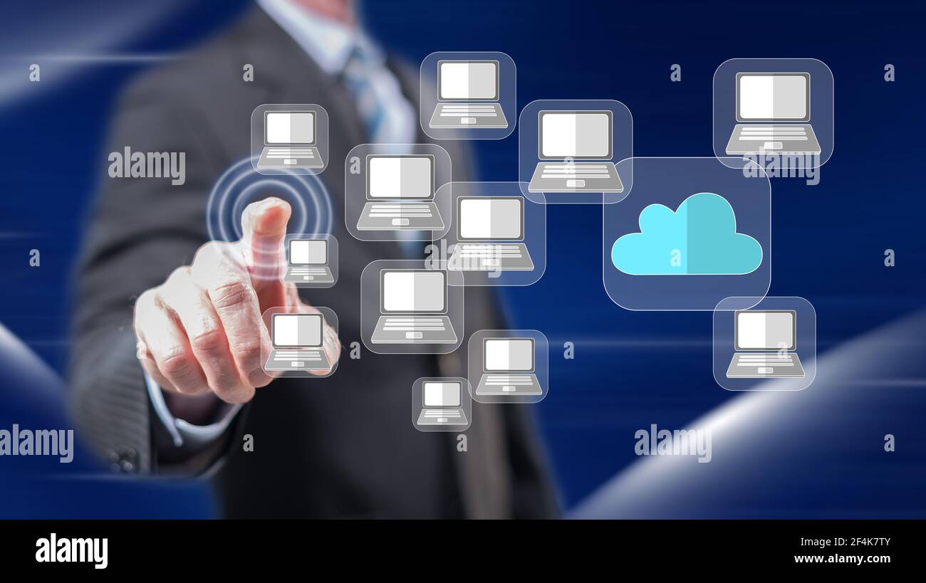 Man touching a cloud computing concept on a touch screen with his ...