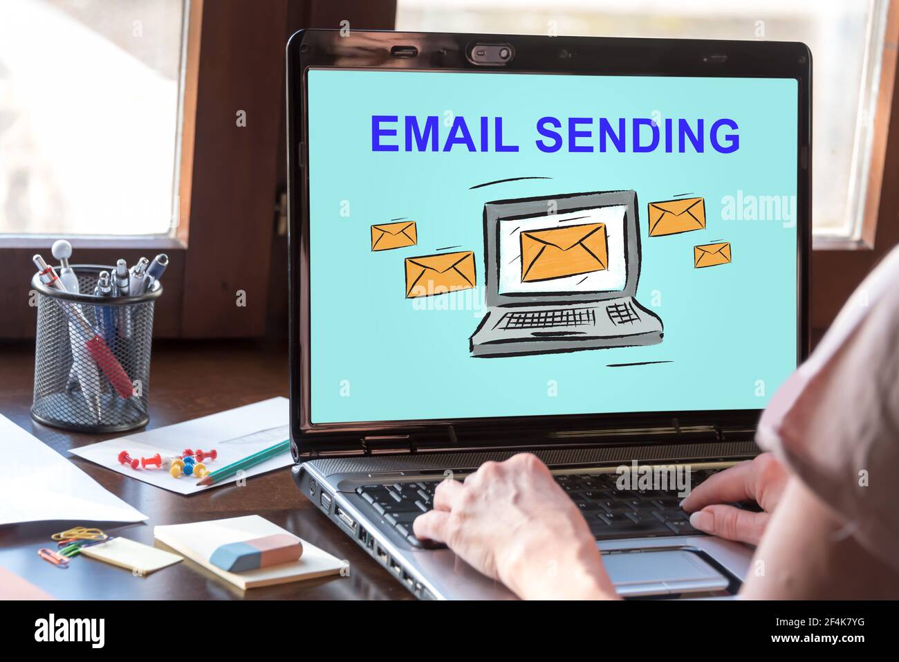 Laptop screen displaying an email sending concept Stock Photo - Alamy