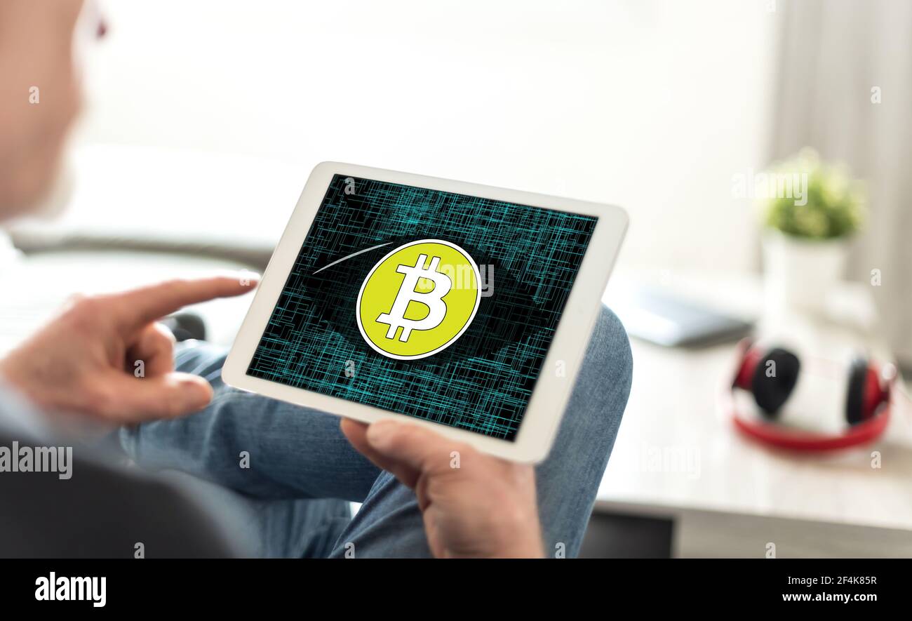 Tablet screen displaying a bitcoin concept Stock Photo - Alamy