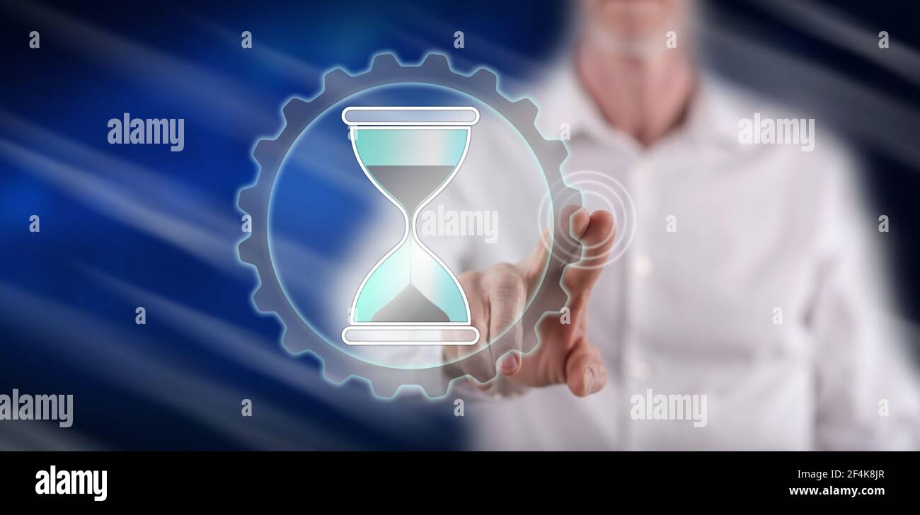 Man touching a time management concept on a touch screen with his ...