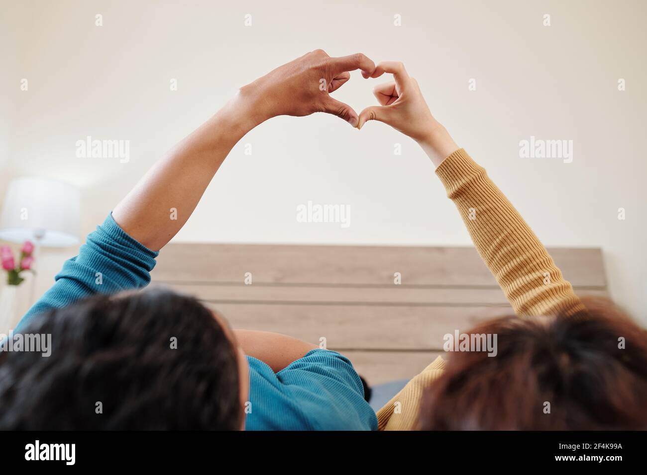 Young couple making love bed hi-res stock photography and images - Alamy