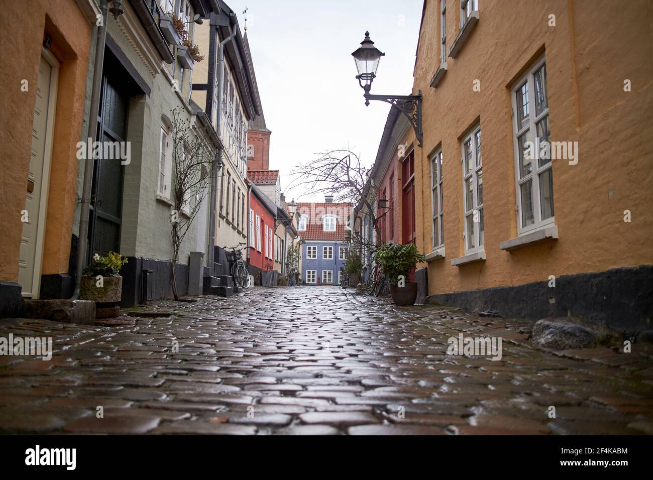 a small street road with colored houses Stock Photo - Alamy